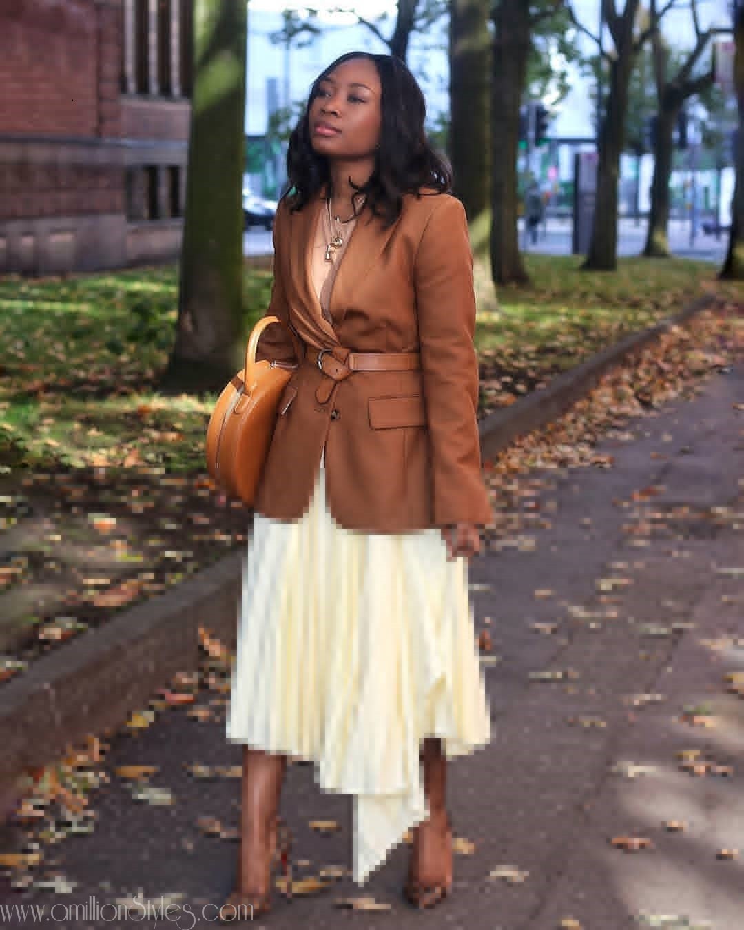 Get Inspiration On How To Style Pleated Skirts From These Fashionistas ...